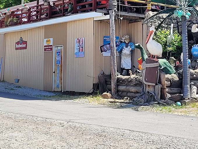 The unassuming yellow exterior of Tackle Box 2 might fool you, but that fisherman statue knows what's up—seafood treasures await inside this riverside gem.