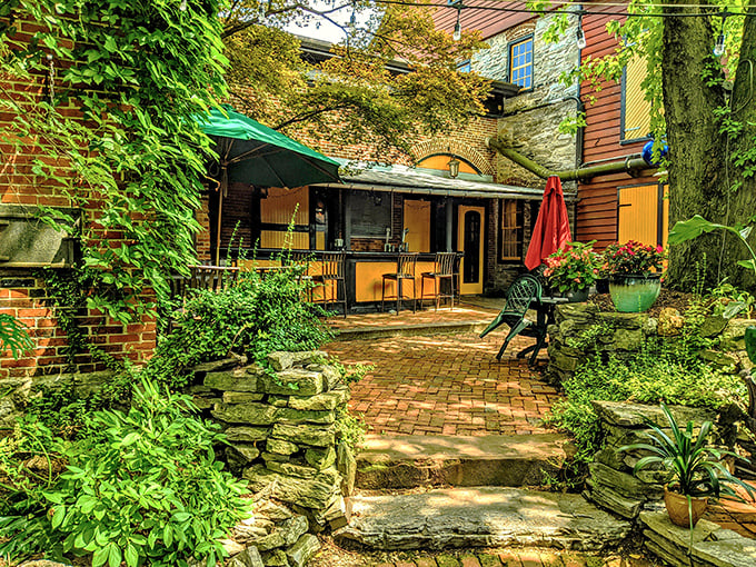 A secret garden oasis awaits behind brick walls, where ivy-draped stonework and dappled sunlight create Pennsylvania's most enchanting brewery courtyard.