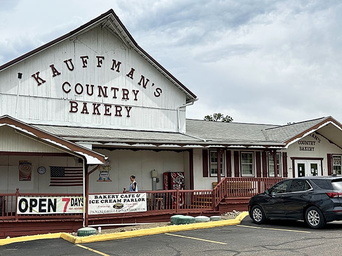 The classic white façade of Kauffman's Country Bakery stands like a beacon of carb-laden hope in Amish Country, complete with charming red railings and welcoming porch.