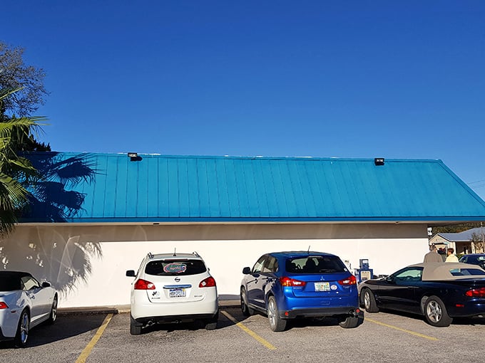 The iconic teal roof of Popi's Place IV stands like a beacon for hungry travelers, promising home cooking that delivers on flavor without any pretense.