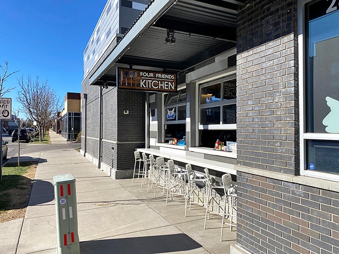 A welcoming sidewalk view showcases the restaurant's sleek design and outdoor seating area—perfect for people-watching while sipping that essential morning coffee.