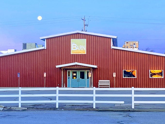 The Barn stands proudly against the Kansas sky, its red exterior and white fence promising comfort food treasures within. Like a beacon for hungry travelers.