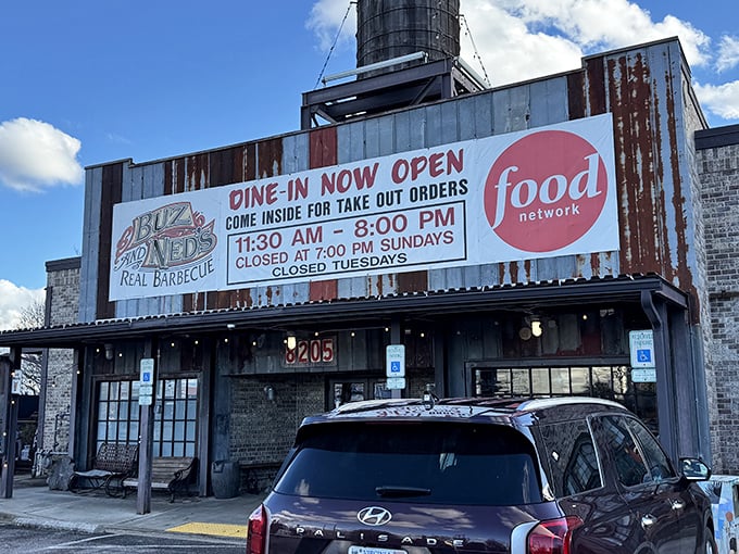 The rusted metal exterior isn't putting on airs—it's saying "we're too busy perfecting barbecue to worry about fancy facades." Food Network approved!