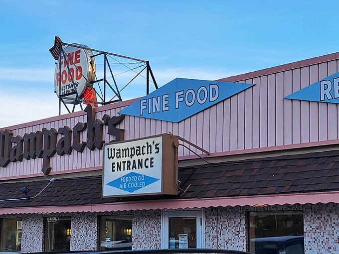 Wampach's iconic vintage sign promises "FINE FOOD" – a nostalgic beacon of comfort that's been drawing hungry Minnesotans for generations.