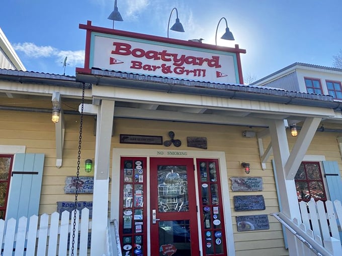 The cheerful yellow exterior with its white picket fence isn't trying too hard—it's just promising good times and better seafood ahead.