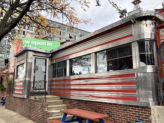 The gleaming stainless steel exterior with bold red stripes isn't just eye-catching—it's a time machine disguised as a diner in Philadelphia's Northern Liberties neighborhood.