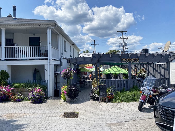 The white facade with its charming picket fence and hanging flower baskets isn't just curb appeal—it's O'Rorke's way of saying "you're home now, hungry traveler."