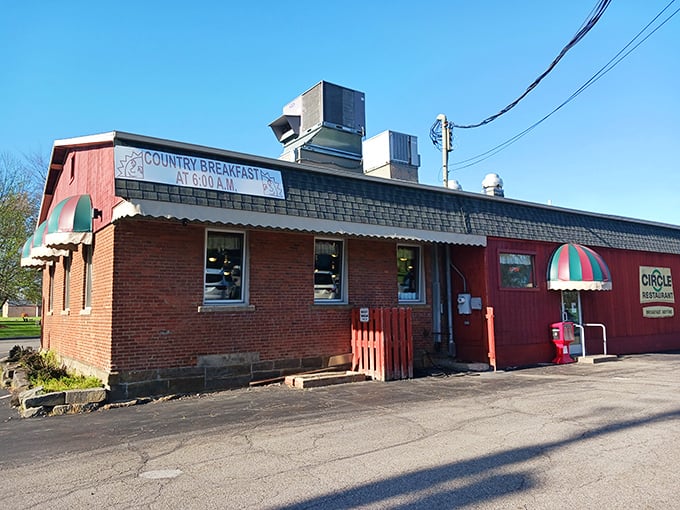 The bright red exterior of Circle Restaurant stands like a beacon of breakfast hope, proudly declaring "BREAKFAST ANYTIME" – words that warm the soul.