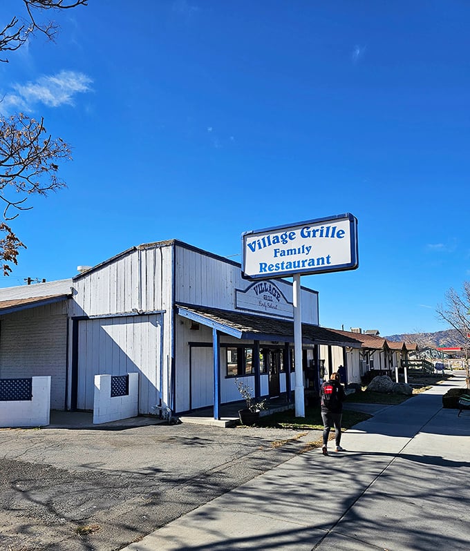From another angle, the Village Grille's classic roadside charm shines under California's brilliant blue sky – a time capsule of American dining waiting to be discovered.