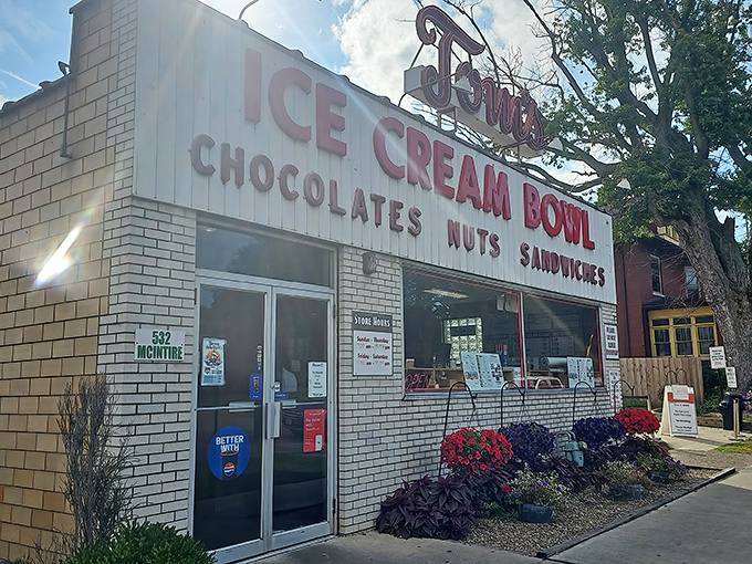 The unassuming white brick façade of Tom's Ice Cream Bowl stands as a beacon to ice cream pilgrims. This isn't architecture—it's a promise of deliciousness inside.