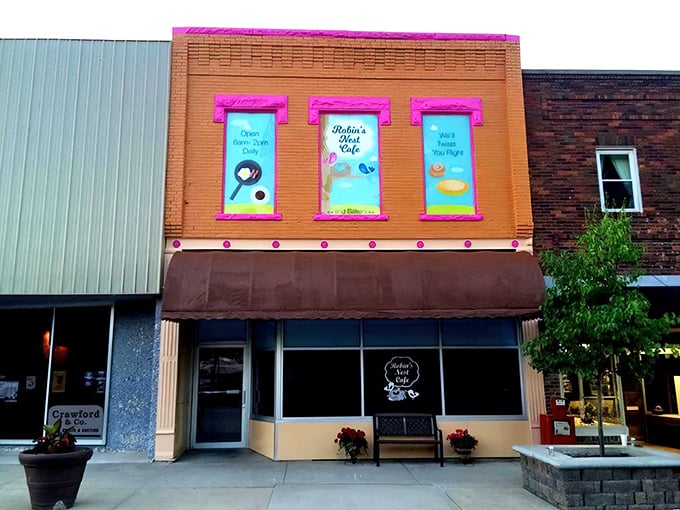 Bright pink window displays announce Robin's Nest Café like a cheerful billboard for breakfast bliss.