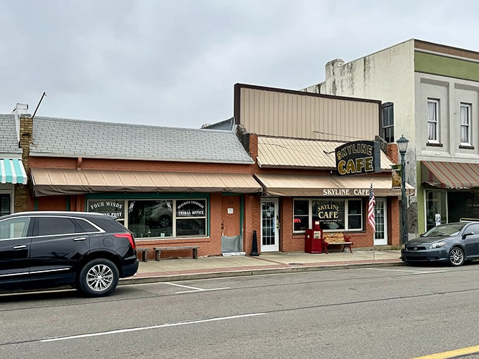 Downtown Mena's culinary cornerstone stands proudly with its vintage signage and welcoming red bench—a postcard-perfect slice of Americana.