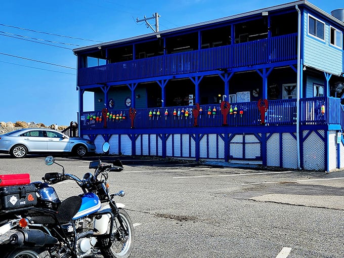 From another angle, Ray's blue facade feels like a cheerful sentinel on the coast, where motorcycles and cars gather like pilgrims at a seafood shrine.