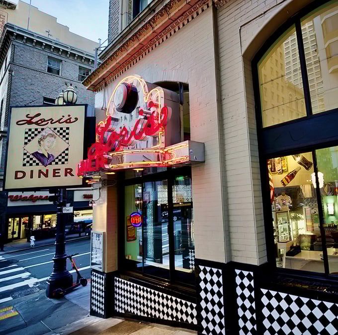 That neon glow isn't just lighting up Mason Street—it's a beacon calling all hungry time travelers to Lori's Diner, where nostalgia comes with a side of fries.