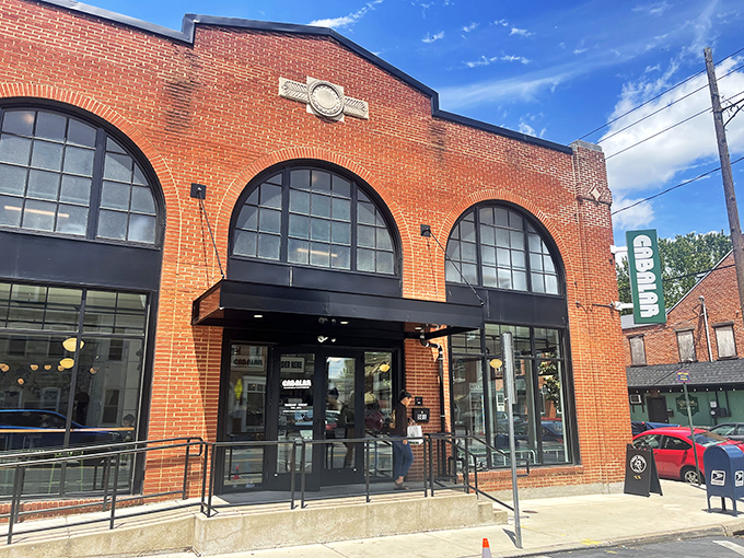 The historic brick façade with grand arched windows isn't just inviting—it's practically whispering "come in and eat something life-changing" to Lancaster passersby.