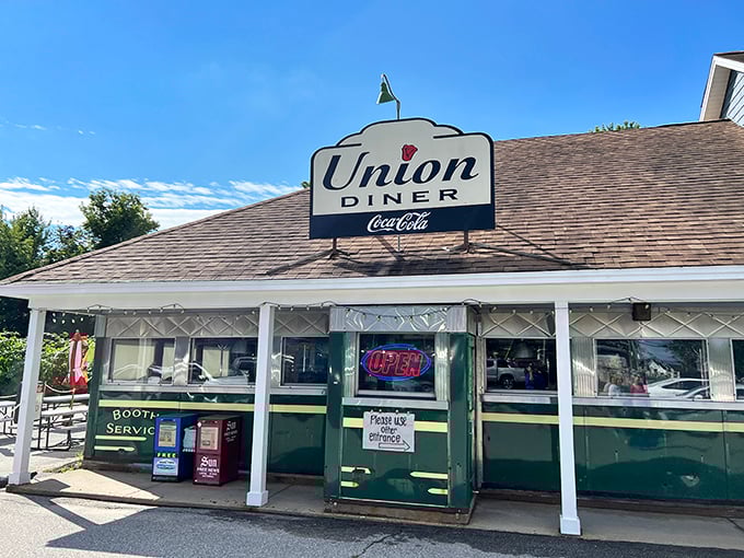 The iconic Union Diner sign beckons hungry travelers to Laconia's breakfast paradise under perfect New Hampshire blue skies.