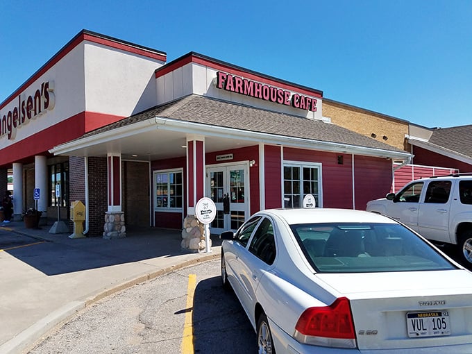The red-sided FarmHouse Cafe stands like a beacon of breakfast hope in Omaha, promising comfort food that's worth setting your alarm for.