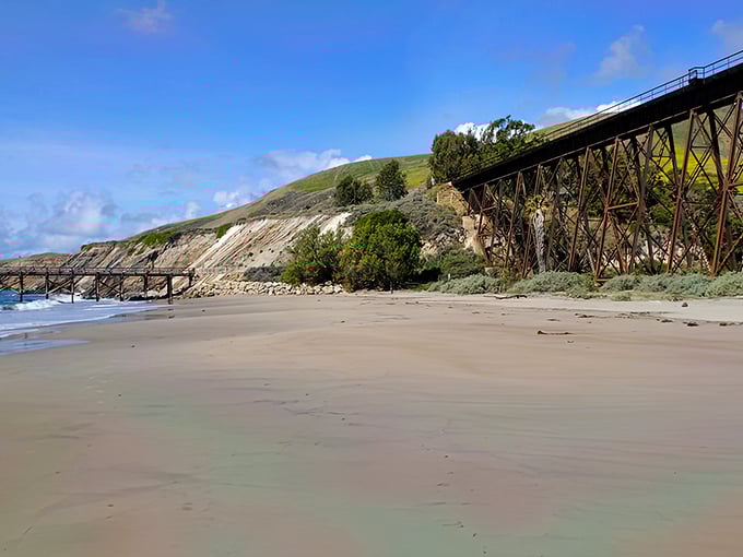 The iconic railroad trestle frames Gaviota's golden sands like nature's perfect postcard. Where engineering meets wilderness in spectacular harmony.