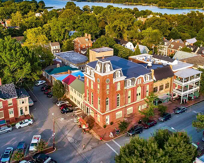 Chestertown's historic district from above – where red brick buildings and blue water create a postcard-perfect tableau that's been charming visitors since George Washington's day.