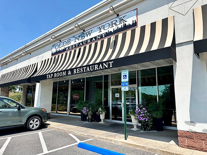 The classic black and white awning isn't just for show – it's the culinary equivalent of a "you are here" marker for German food paradise.