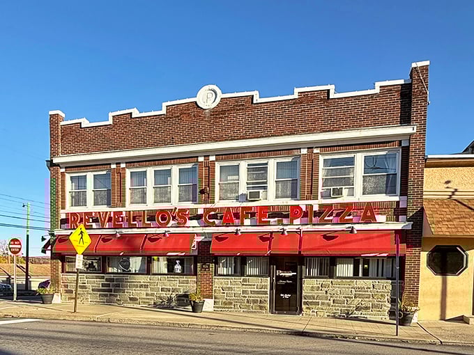 The classic brick façade with those iconic red awnings stands like a beacon of comfort food on Old Forge's Main Street—a timeless invitation to pizza paradise.