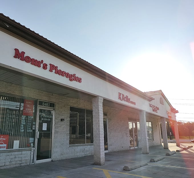 The unassuming storefront of Mom's Pierogies in Brooklyn, Ohio – where culinary magic happens behind a modest strip mall facade.