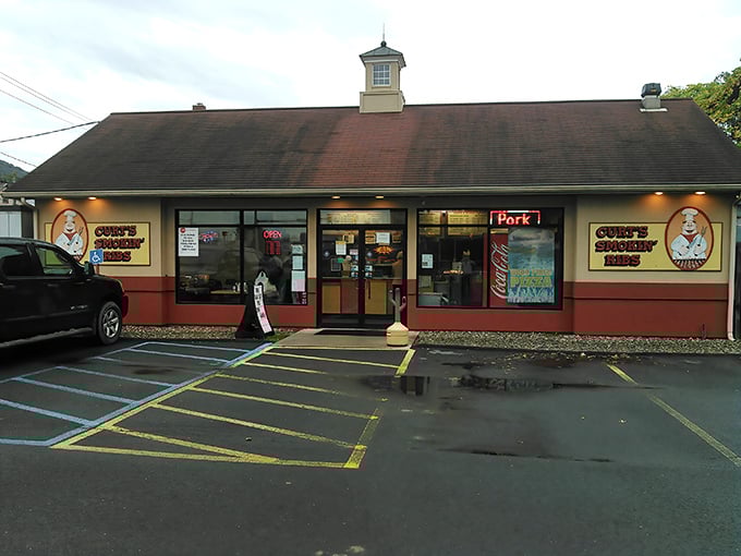 The humble exterior of Curt's Smokin' Ribs belies the flavor explosion waiting inside. That cartoon chef knows what's up!