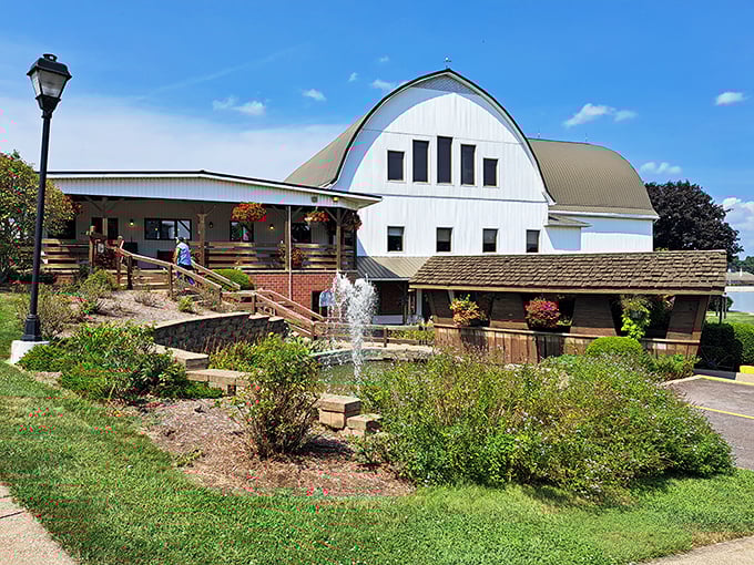 The iconic curved roof of The Barn Restaurant stands proudly against Ohio's blue sky, promising comfort food that'll make your cardiologist wince and your soul sing.