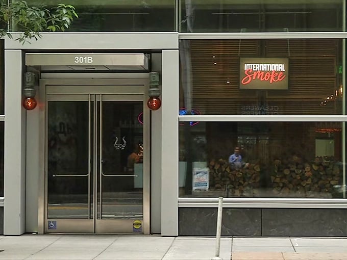 Look for the glowing red sign at 301B Mission Street—your portal to a world where smoke and fire transform ingredients into magic.