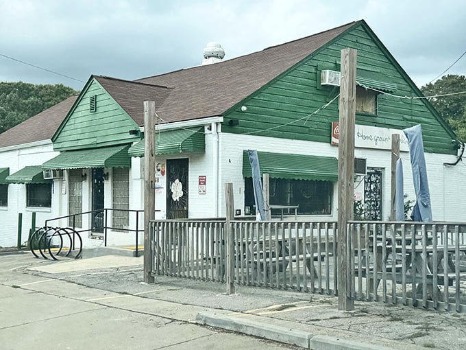 From another angle, the modest facade reveals a wooden porch railing—the last barrier between you and Southern comfort food nirvana.