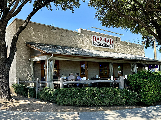 The limestone facade of Railhead Smokehouse stands like a humble temple to Texas barbecue, promising smoky treasures within those unassuming walls.