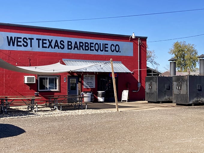 A humble red building that houses barbecue greatness. Those smokers aren't just for show—they're working overtime to create edible masterpieces.