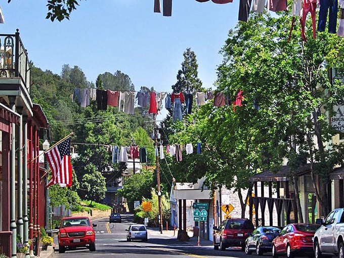 The ultimate small-town parade route without the parade. Multiple lines of sun-drenched laundry create a perpetual celebration above Angels Camp's historic thoroughfare.