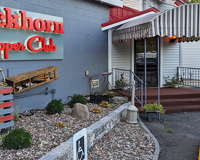 The iconic red lettering against blue-gray siding isn't just a sign—it's a beacon of hope for hungry travelers seeking Wisconsin's supper club salvation.