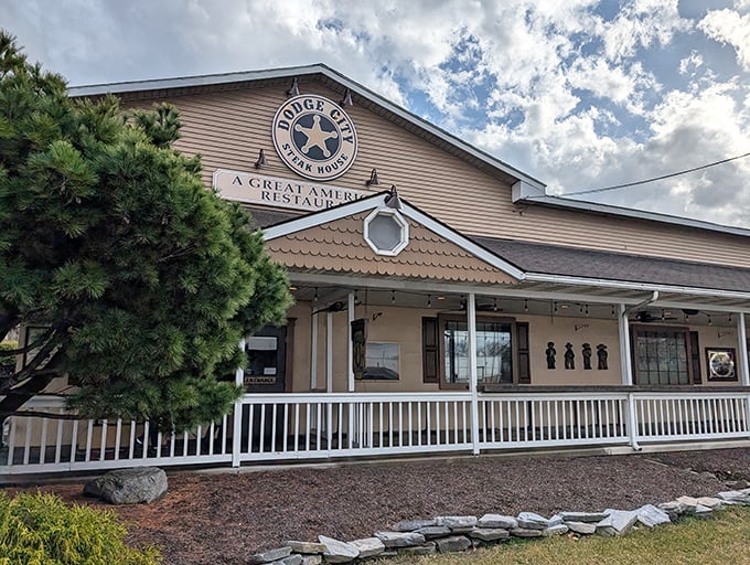 The Western-themed exterior of Dodge City Steakhouse stands ready to welcome hungry travelers, promising carnivorous delights within its rustic walls.