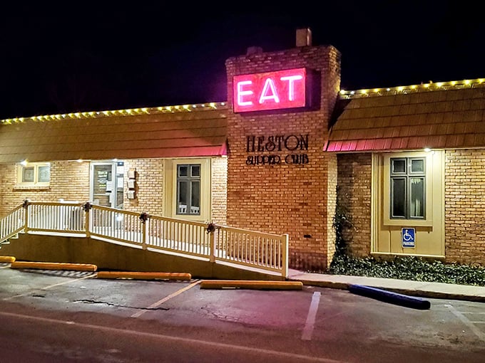 That glowing "EAT" sign at night is basically a beacon calling all hungry souls home to happiness.