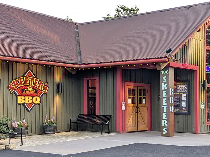 The welcoming entrance says it all – no pretension here, just the promise of serious BBQ behind those wooden doors trimmed in cheerful red.