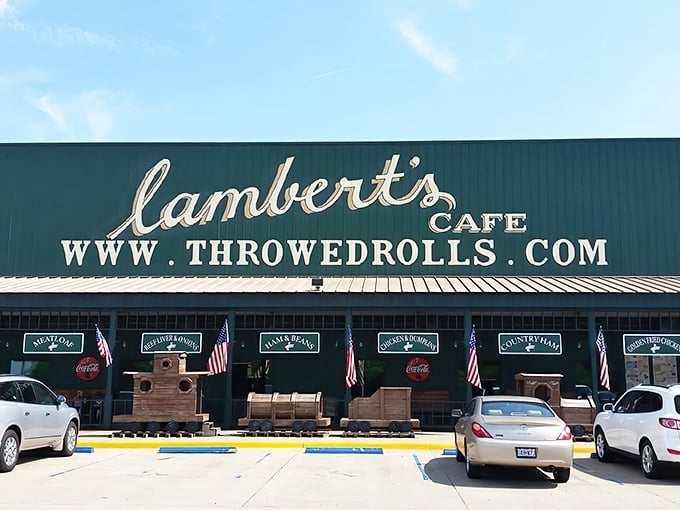 The green exterior of Lambert's proudly announces its identity as the "Home of Throwed Rolls" – a promise of both sustenance and entertainment.