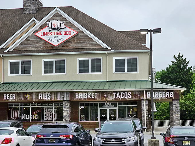 The stone-and-wood facade of Limestone BBQ isn't just inviting—it's practically sending smoke signals to your stomach from miles away.