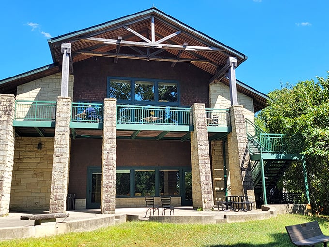 The rustic grandeur of Lake Hope Lodge rises from the forest like nature's own cathedral, complete with stone pillars and green accents that echo the surrounding trees.