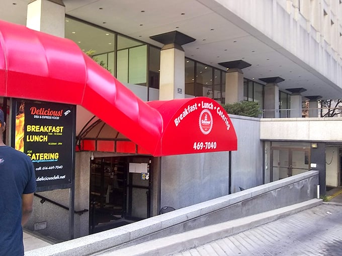 That bold red awning beckons like a lighthouse guiding hungry sailors to their corned beef destiny.