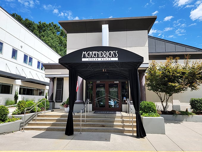 The entrance to McKendrick's stands like a culinary embassy—diplomatic immunity from mediocre meals awaits behind those wooden doors.