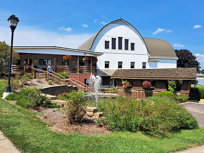 The iconic curved roof of The Barn Restaurant stands proudly against Ohio's blue sky, promising comfort food that'll make your cardiologist wince and your soul sing.