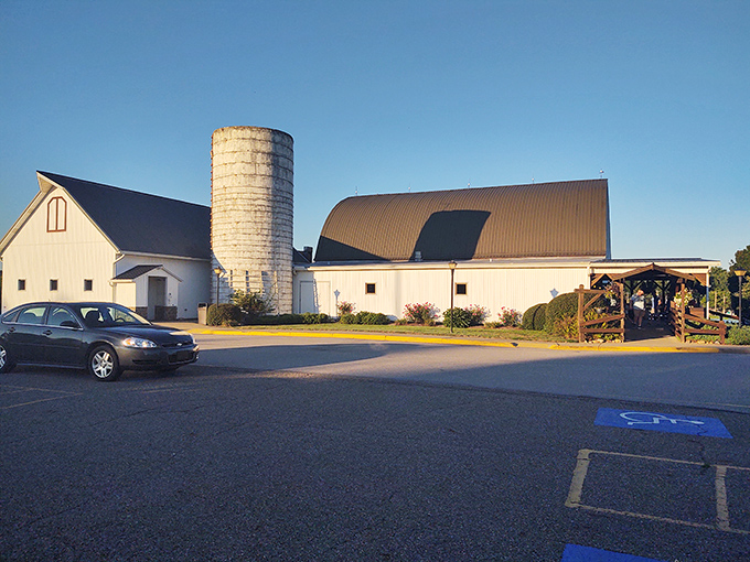 The iconic white barn structure stands proudly against an Ohio blue sky, its silo and curved roof promising comfort food treasures within.