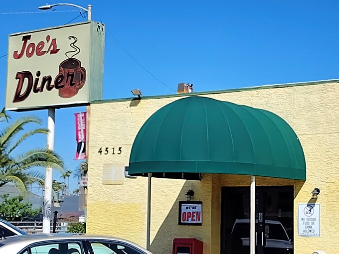 That iconic yellow building with the green awning isn't trying to win architectural awards—it's saving all its energy for what really matters: the food inside.