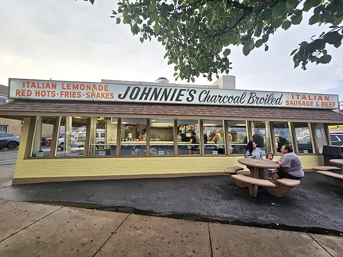 The humble temple of beef worship glows like a beacon in the night, promising salvation in sandwich form to all who make the pilgrimage.