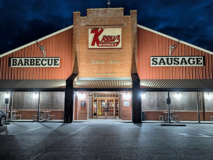 By night, Kreuz Market transforms into a beacon of smoked meat hope, drawing hungry pilgrims like moths to a post-oak flame.