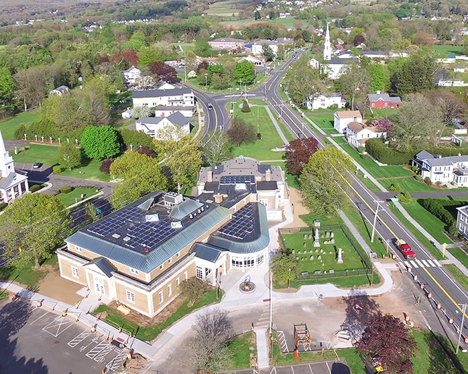 Ellington's town center from above – where New England charm meets modern convenience, complete with solar panels that say "we're traditional, but not stuck in the past."