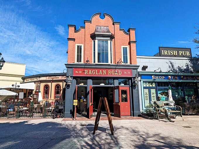 The distinctive red-brick facade of Raglan Road stands out like a Celtic jewel in Disney Springs, promising authentic Irish charm in the Florida sunshine.