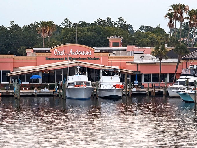 The coral-pink palace of seafood sits proudly on the water, fishing boats bobbing at its doorstep like eager dinner guests waiting for their table.